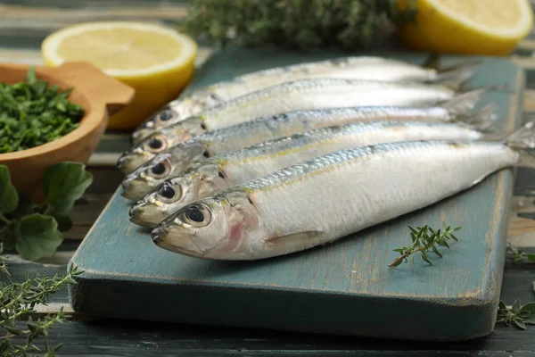 Blue Fish Raw Pilchard Green Table Background Stock Photo by ©denio109 ...