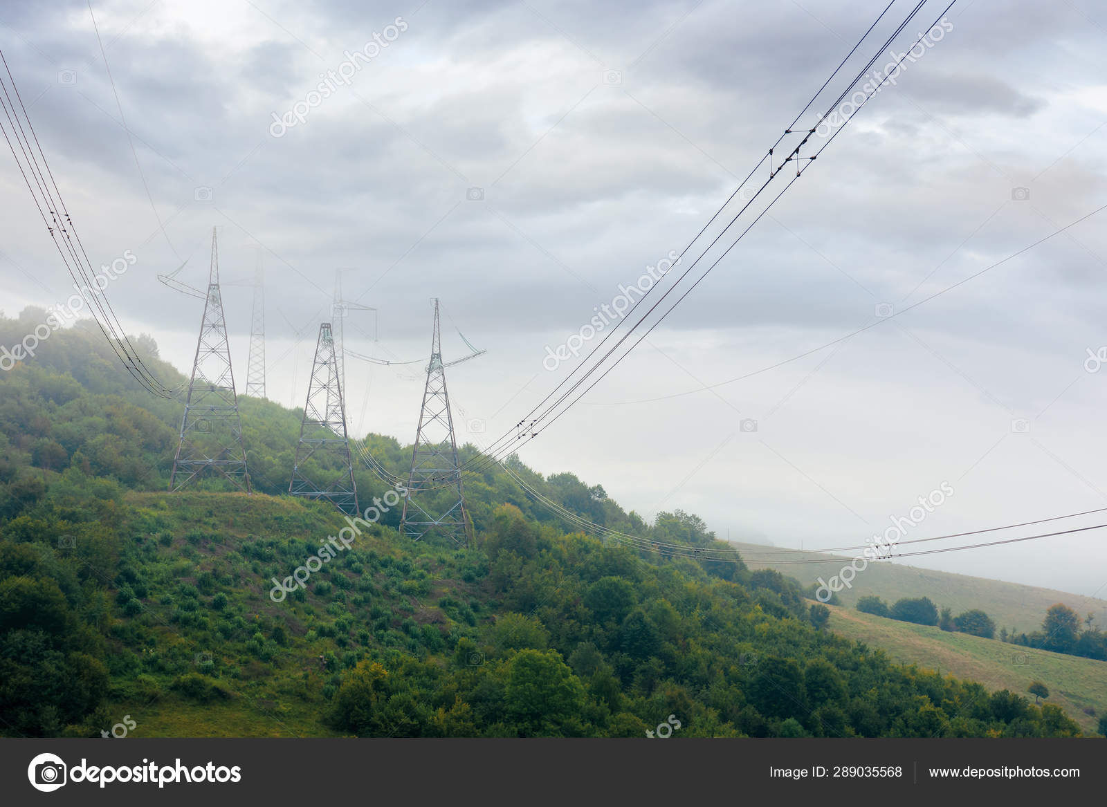 High voltage power lines tower in mountains Stock Photo by ©pellinni ...