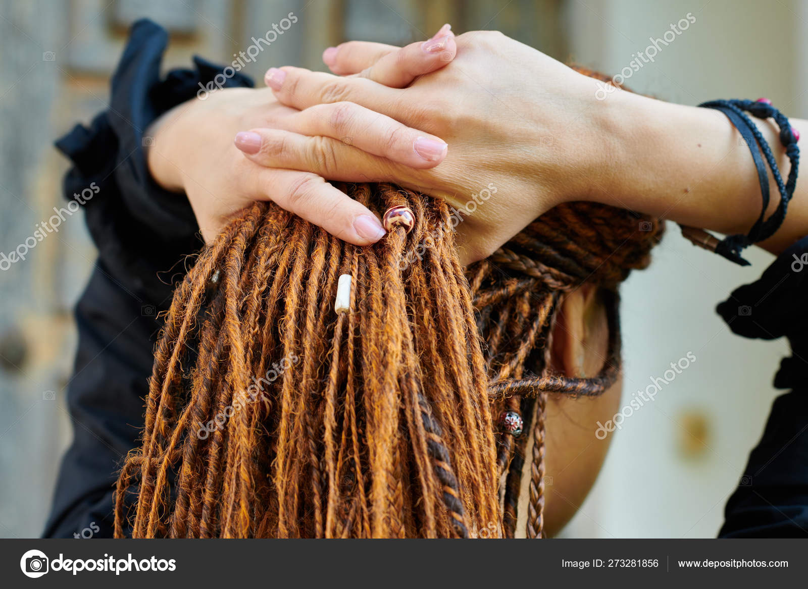 Backside dreadlocks head closeup, fashionable girl posing at old wooden ...