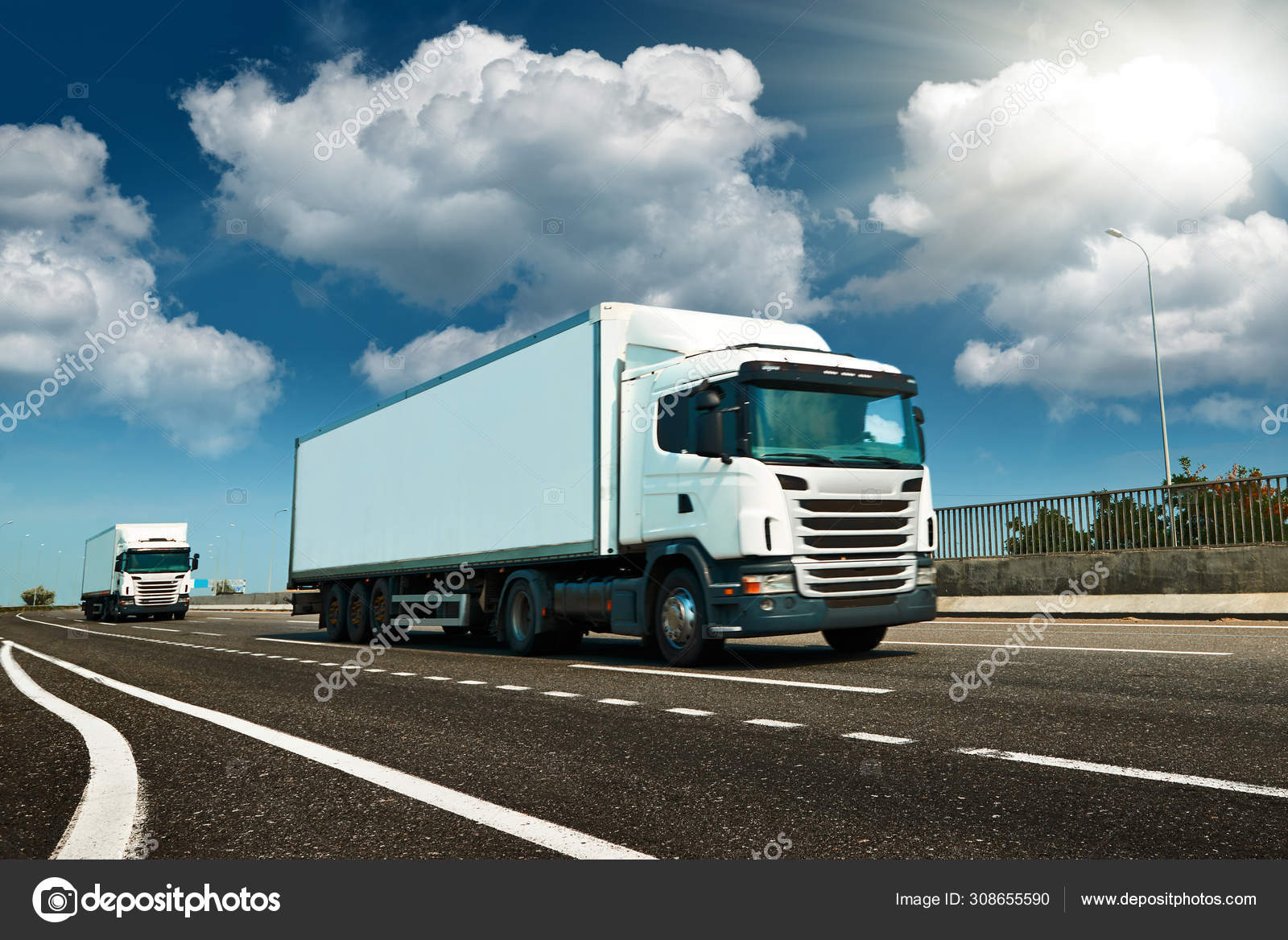 White truck is on highway - business, commercial, cargo transportation ...