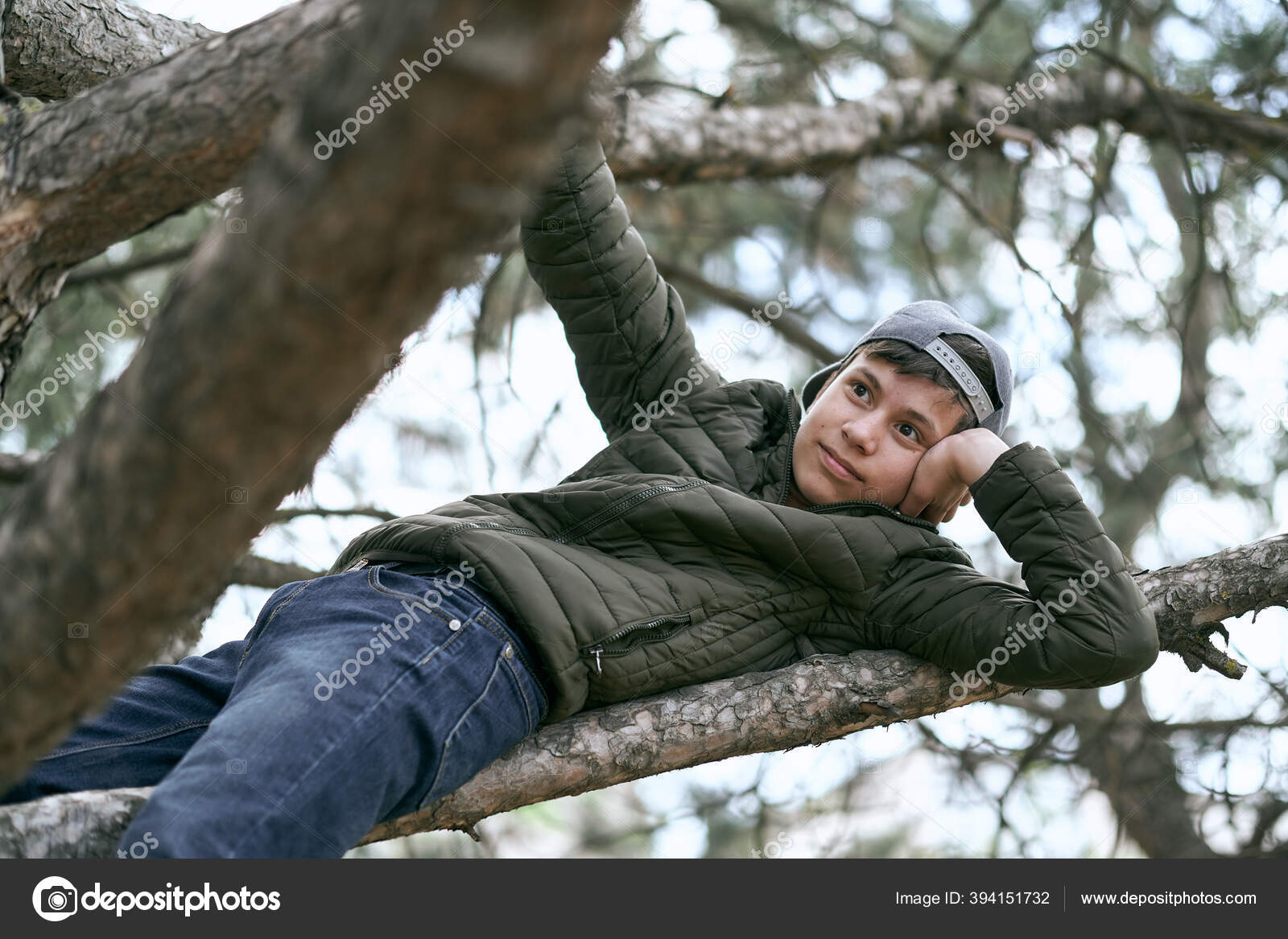 Teenage Boy Poses Tree Lying Big Branch Dreaming Stock Photo by ©soleg ...