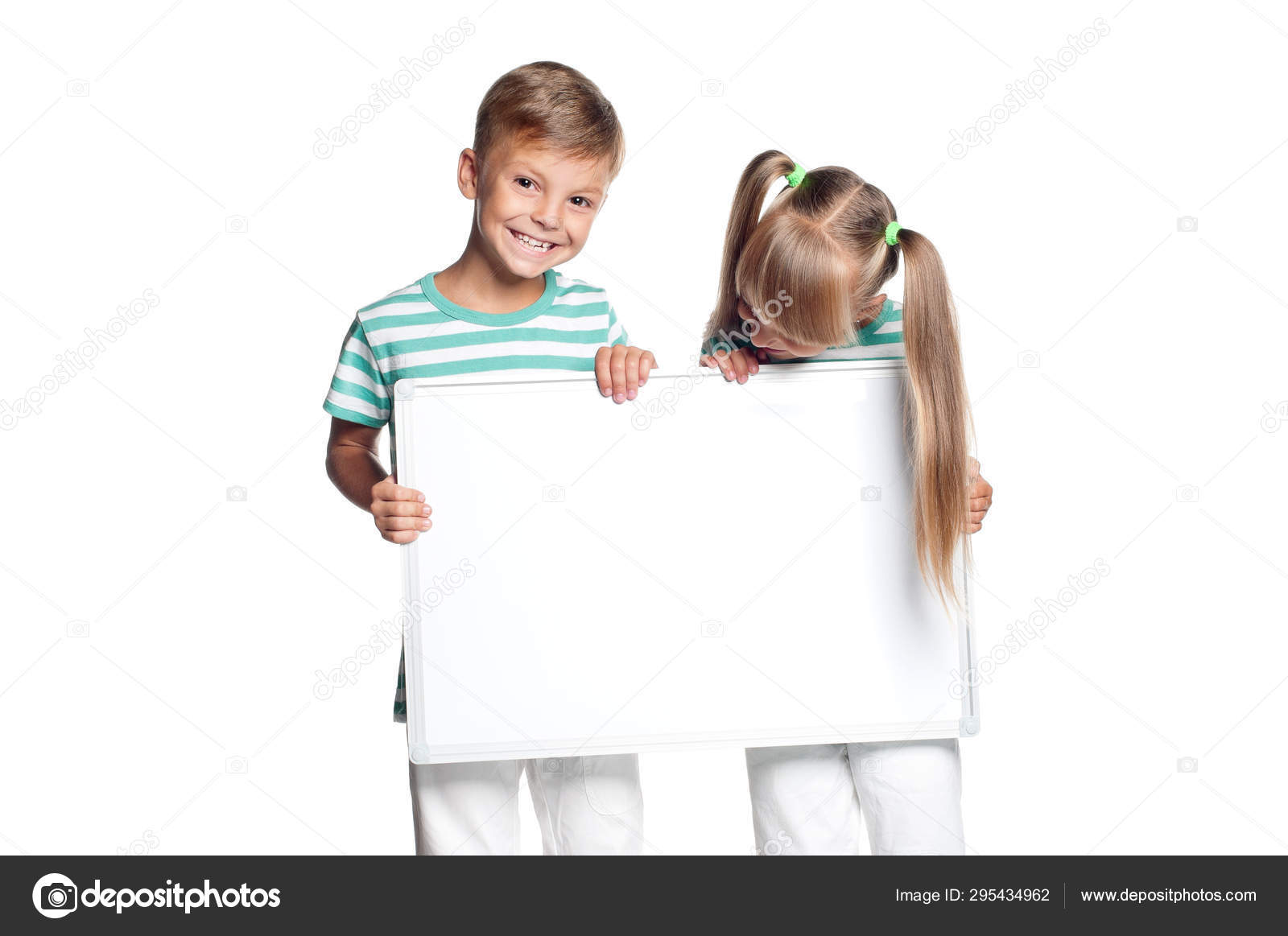 Little boy and girl holding board Stock Photo by ©VaLiza 295434962