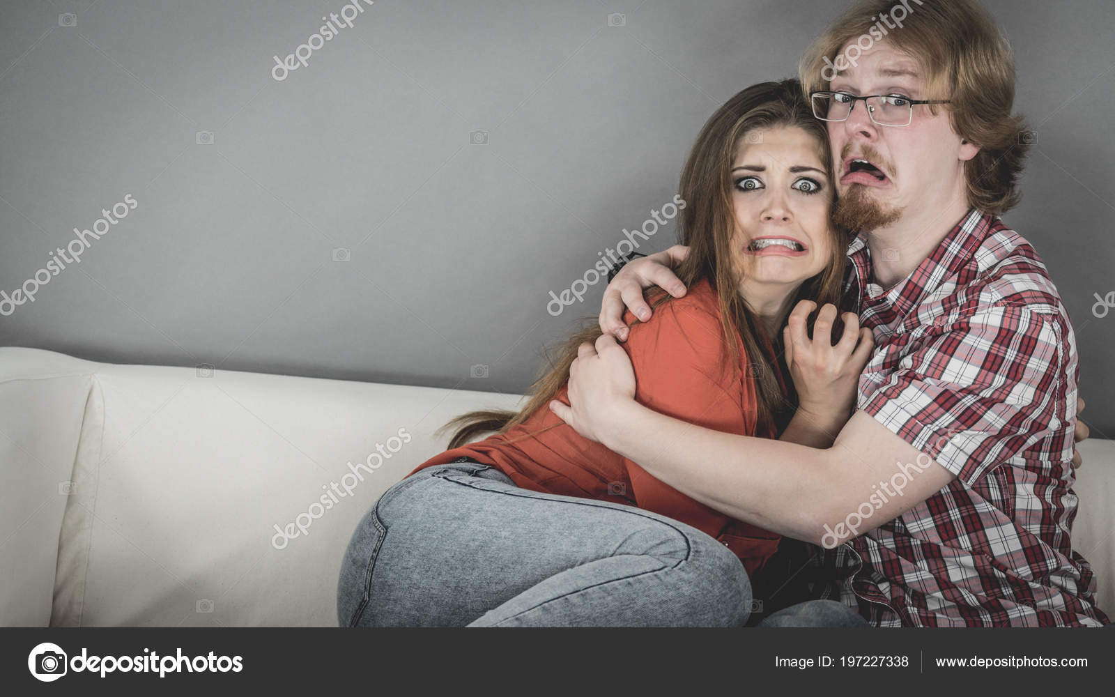 Funny Couple Sitting Sofa Watching Horror Movie Being Scared Hugging ...