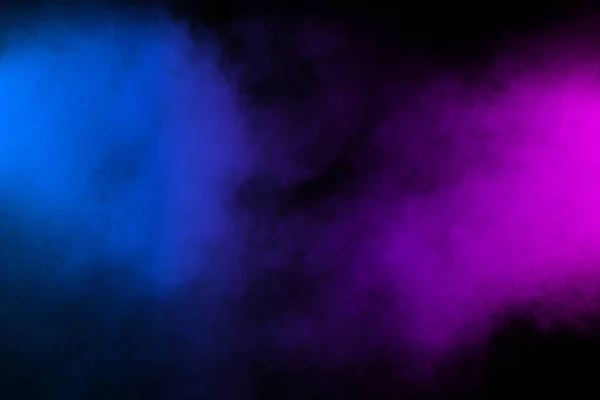 Pink blue powder explosion on black background.Pink blue dust splash ...