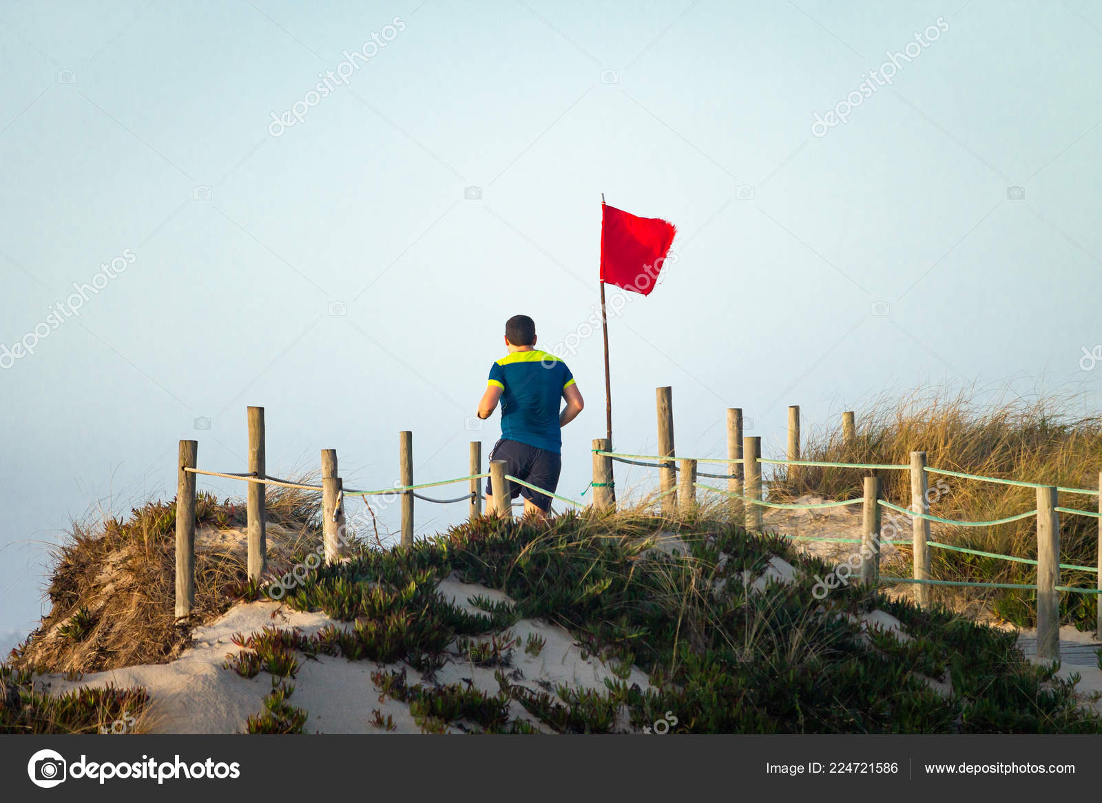 Young Man Runs Boardwalk Dunes Red Flag Blue Shirt Back — Stock Photo ...