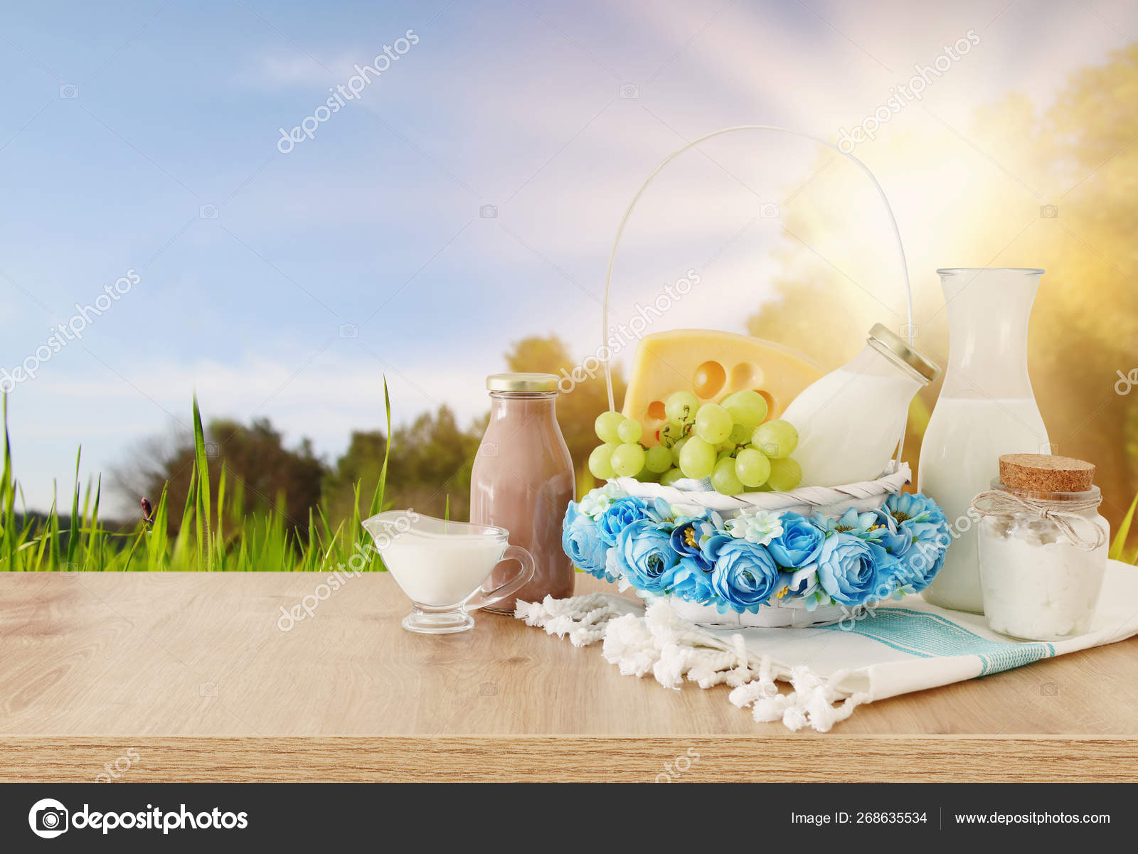 Photo of dairy products over wooden table. Symbols of jewish hol ...