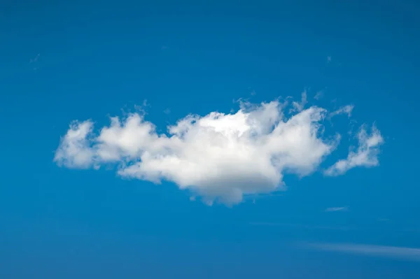 White cloud against blue sky. Blue sky and close-up big cloud in windy ...