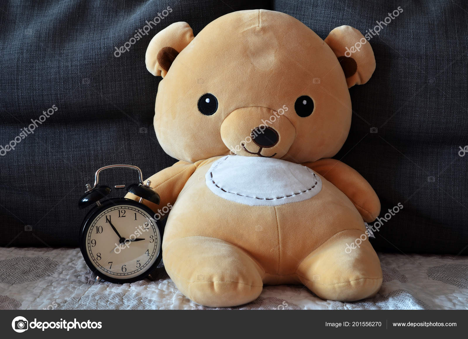 Brown Cute Teddy Bear Hold Alarm Clock Stock Photo by ©tang90246 201556270