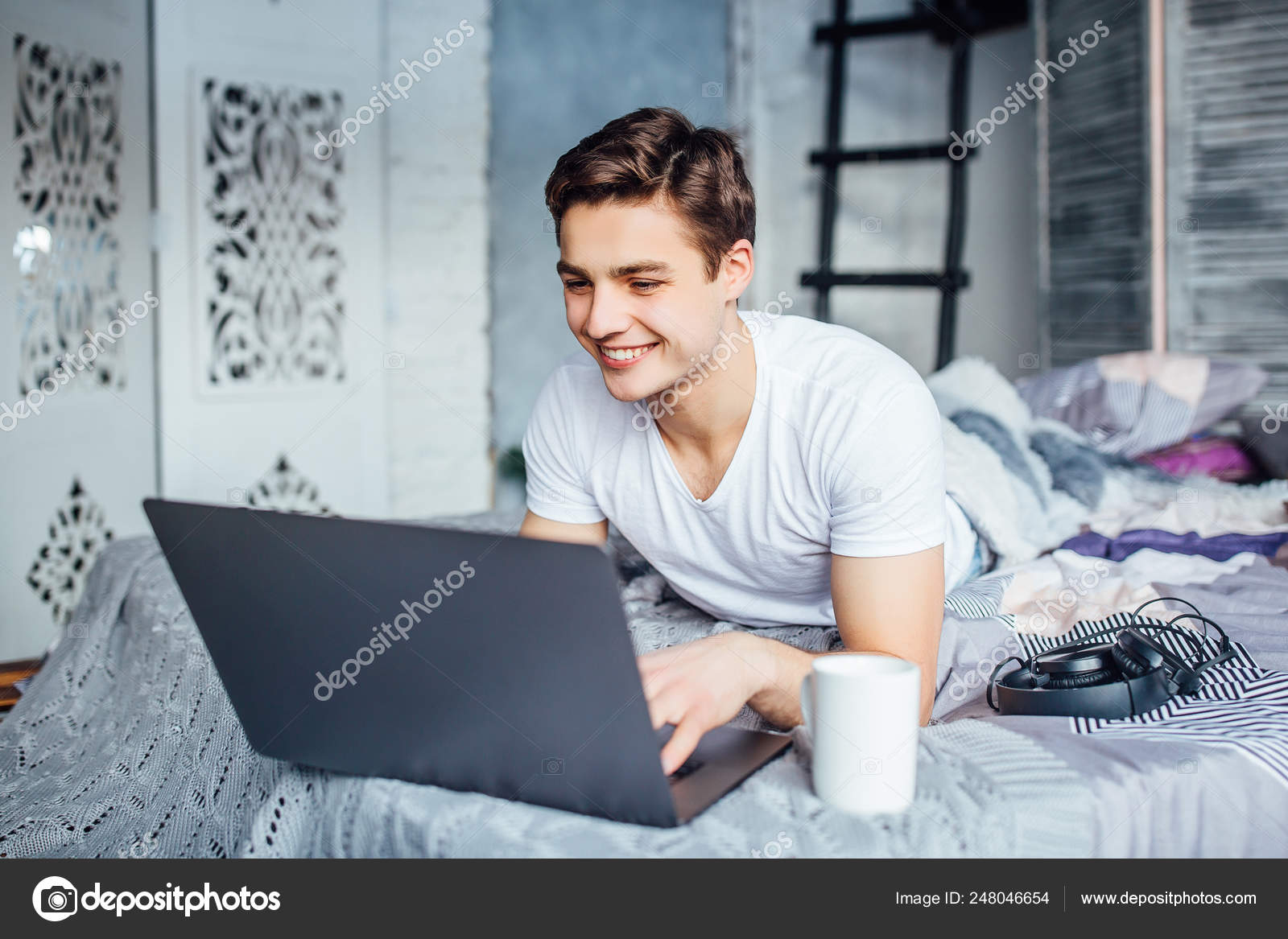 Handsome Man Looking Laptop Smiling Lying Bed Stock Photo by ©taras ...