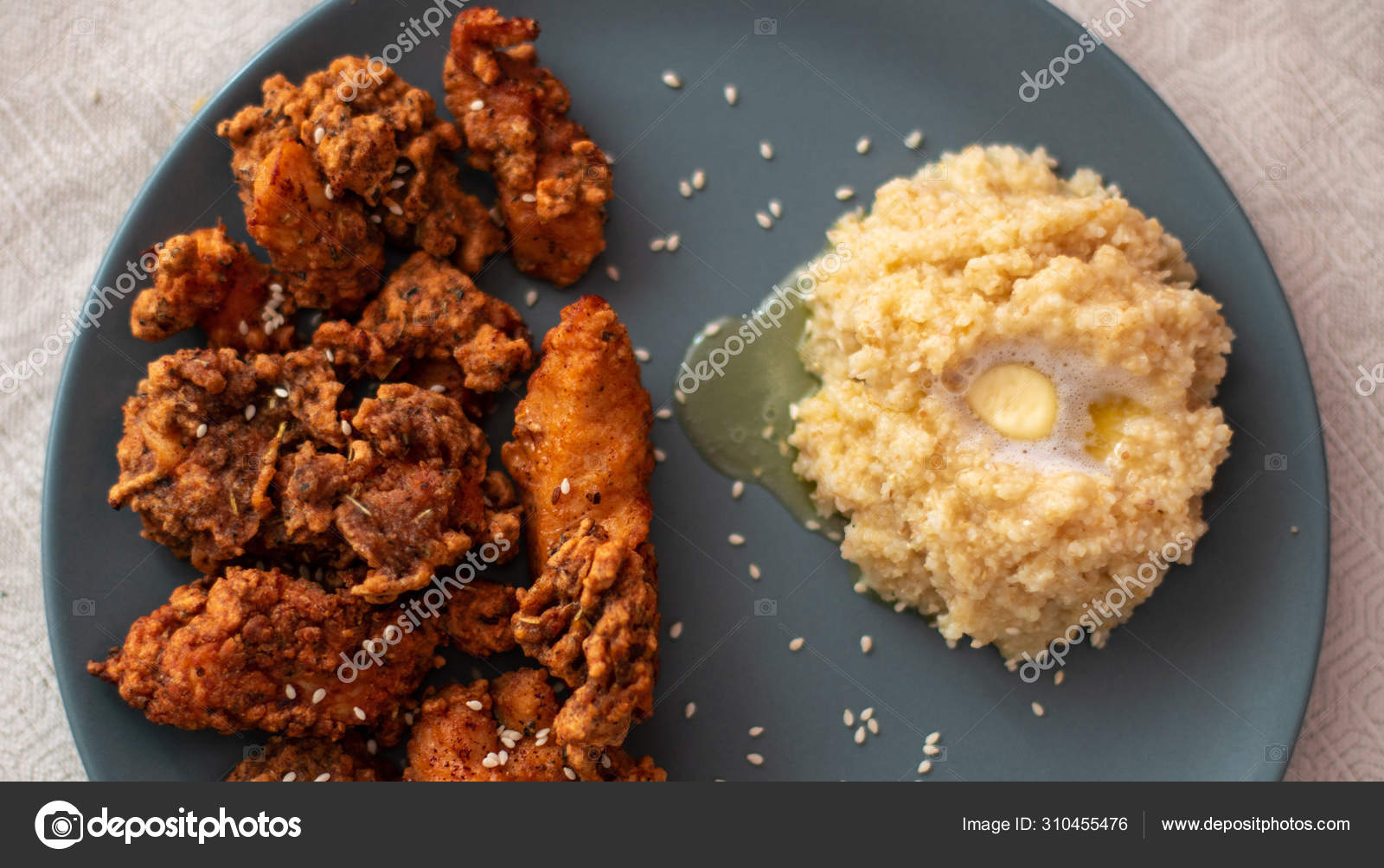 Crispy chicken with garnish of porridge Stock Photo by ©ponomarencko ...
