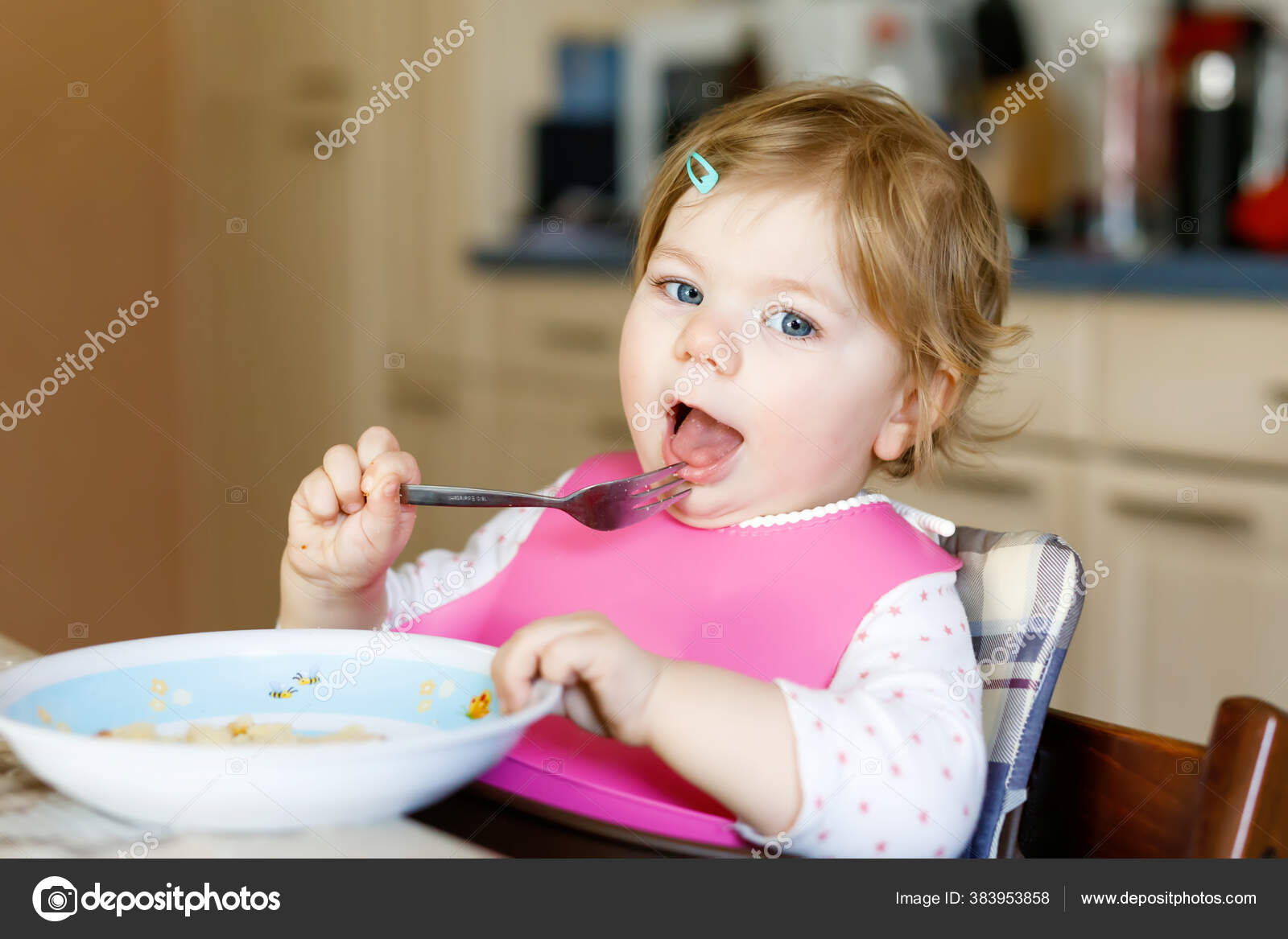 Adorable baby girl eating from spoon mashed vegetables and puree. food ...