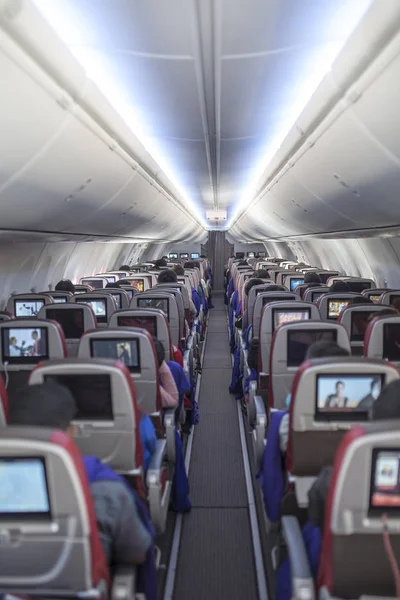 Passengers traveling by a new jet plane, shot from the inside of an ...