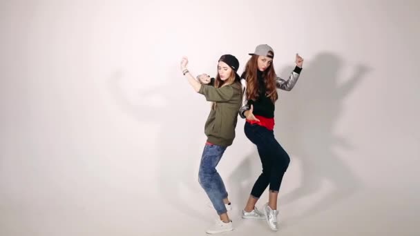 Swag girls dancing back to back and looking at camera. — Stock Video ...