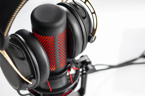 Gaming headphones and microphone with red neon lighting. Gaming devices ...
