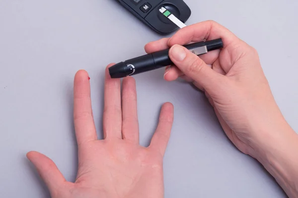 Fingerstick glucose meter Stock Photos, Royalty Free Fingerstick ...