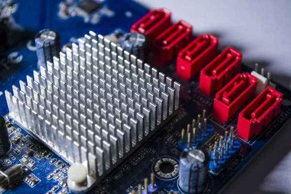 The old motherboard from the computer of blue color. Texture. Spare ...