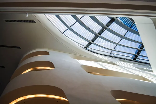 Modern building inside. With slanted and semicircular walls, big ...