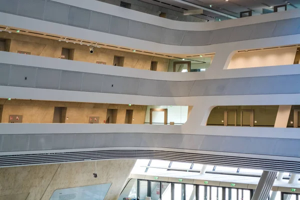 Modern building inside. With slanted and semicircular walls, big ...