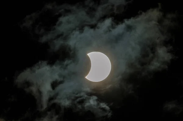 Partial Solar Eclipse on a Cloudy Day - Stock Image - Everypixel