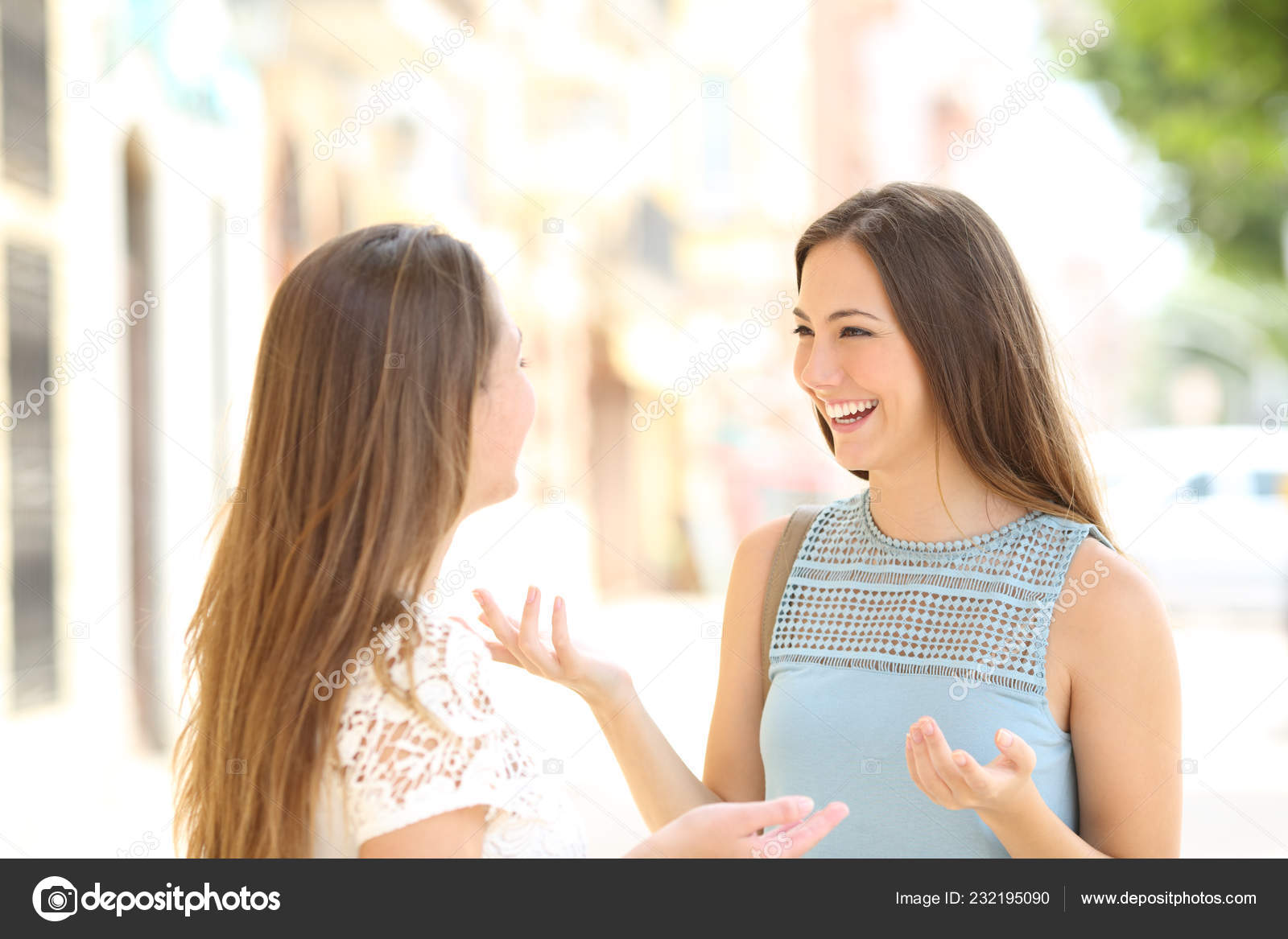 Two Happy Casual Friends Talking Looking Each Other Standing Street ...