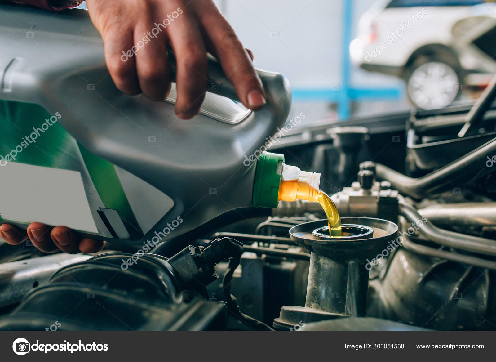 Auto Mechanic Working Garage Maintenance Engine Mechanician Pouring ...