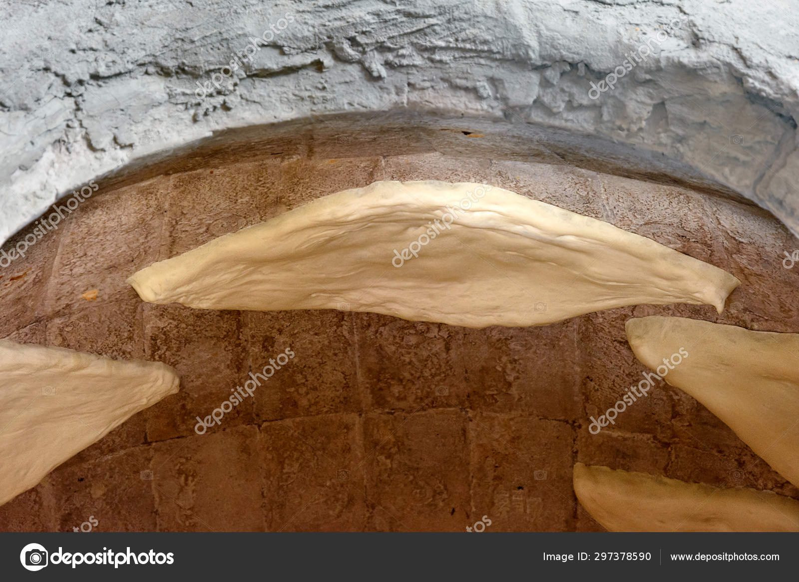 Baking Shotis Puri in tone - traditional Georgian stone oven — Stock ...