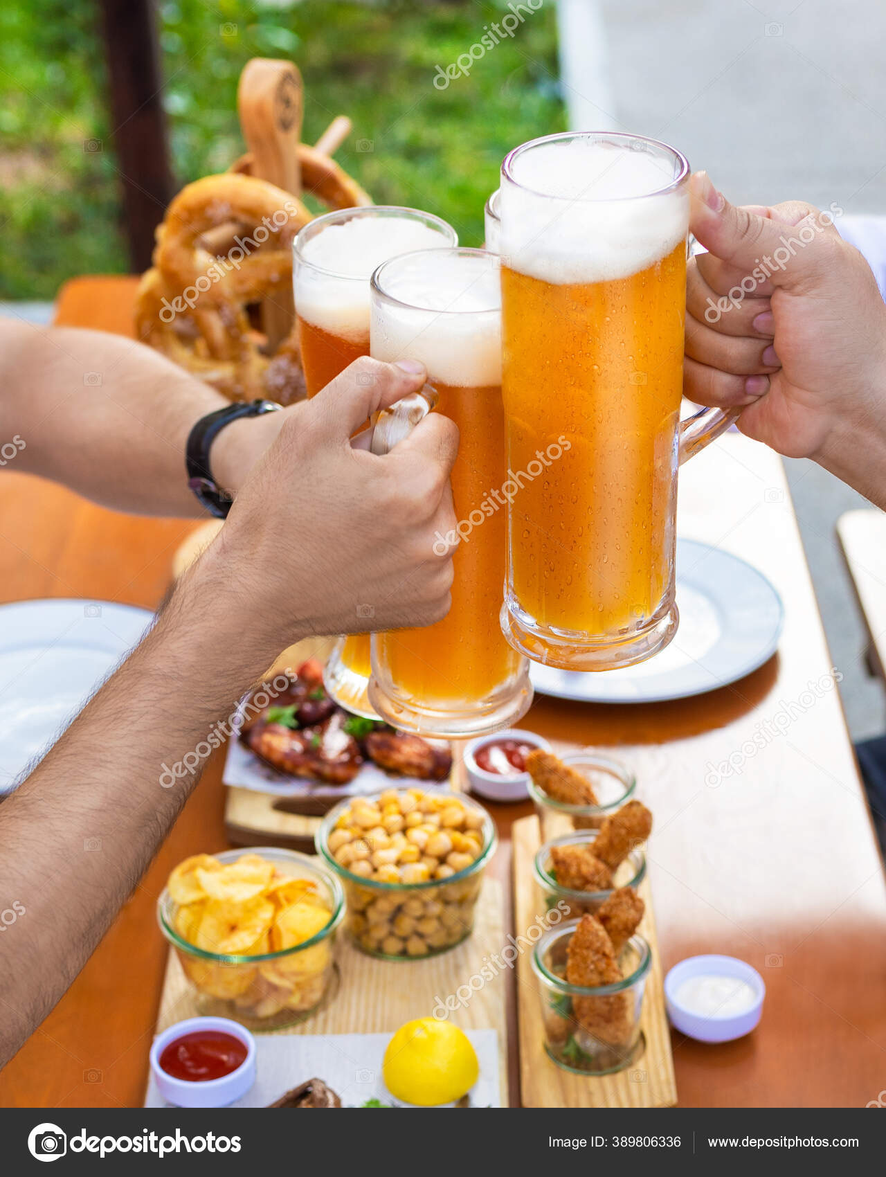 Clinking Beer Mugs Snacks Table — Stock Photo © Farhadib #389806336