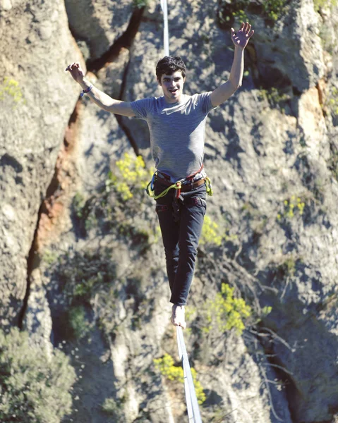 Highliner on a rope. Highline on a background of mountains. Extreme ...