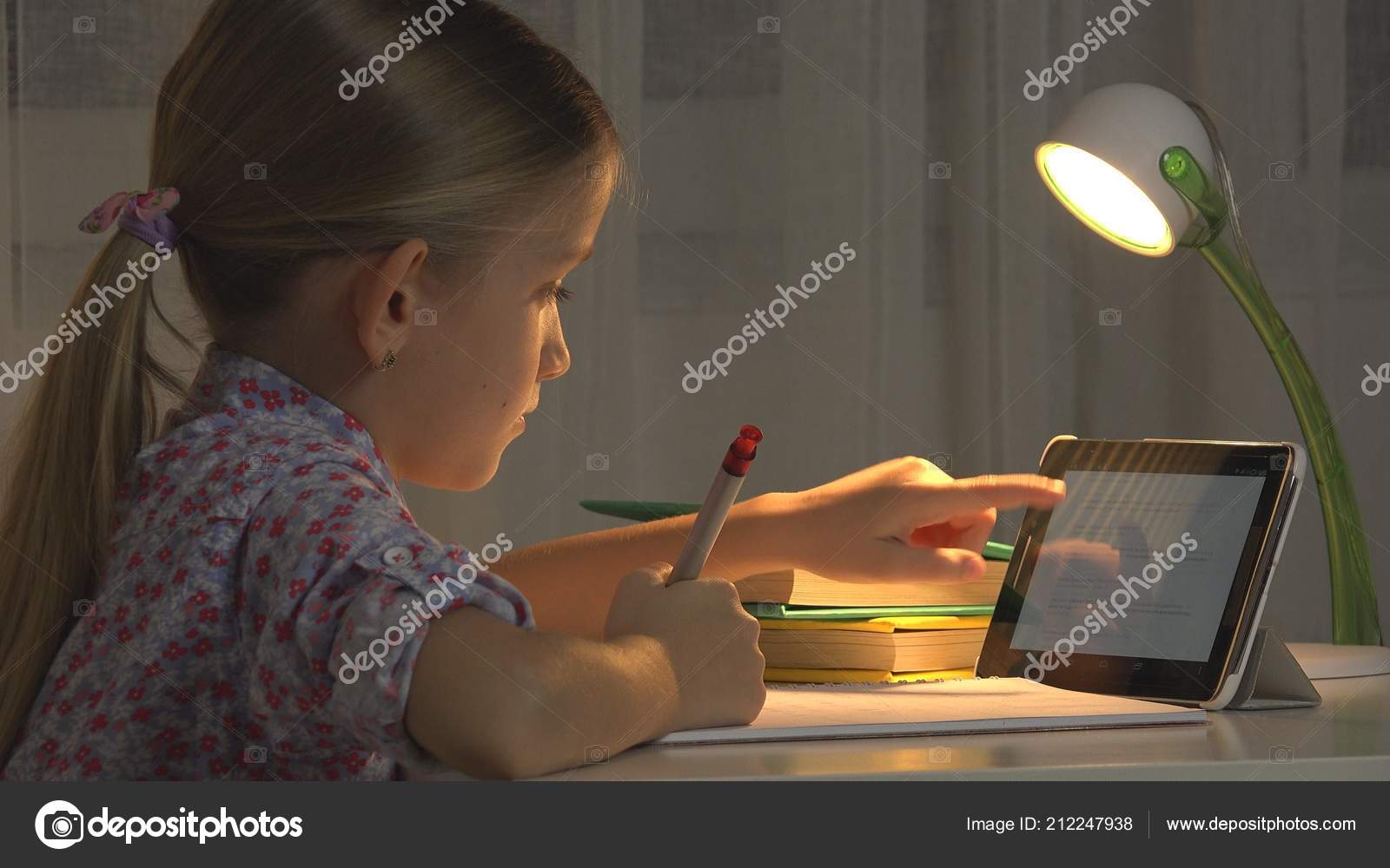 Child Uses Tablet Studying Girl Writing Homework Night Internet Usage ...