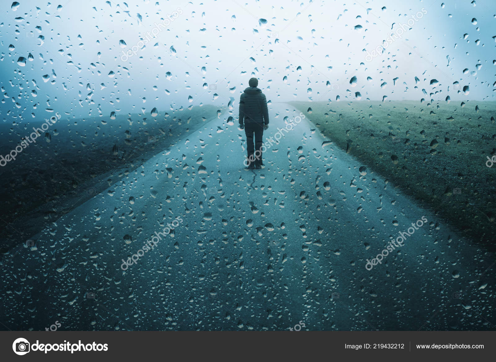 Lonely Man Walking In Rain