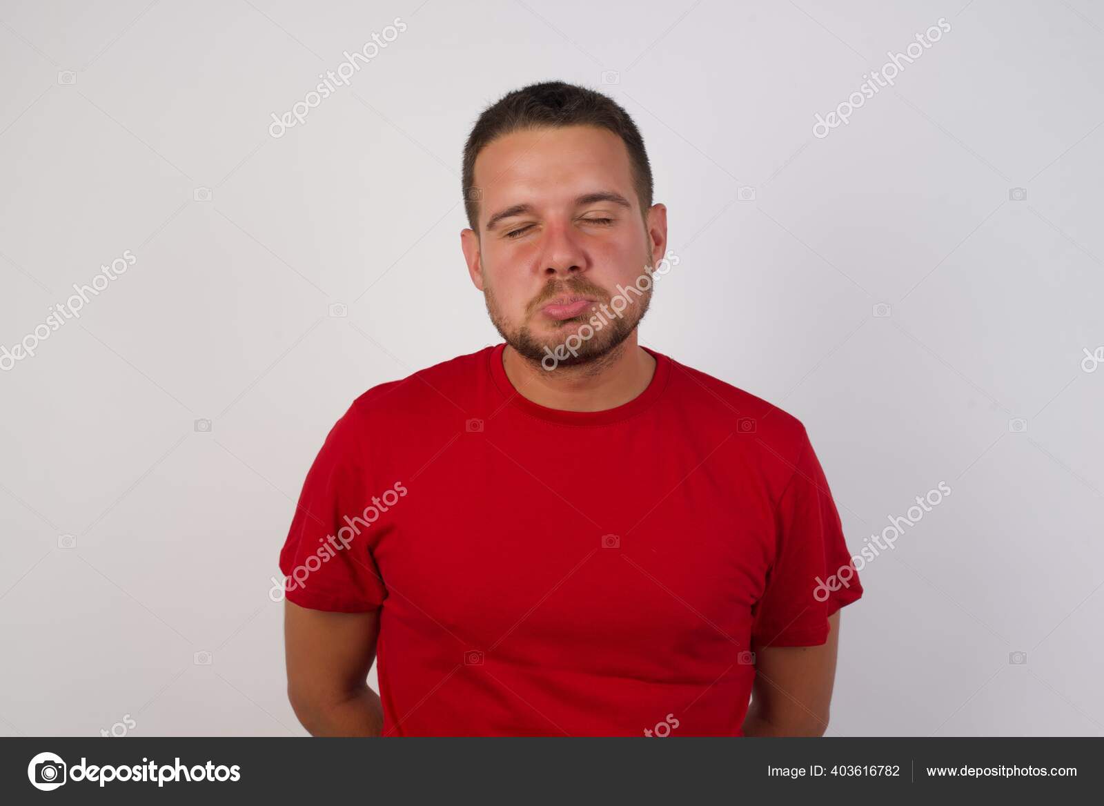 Sad Man Curves Lower Lip Closes Eyes Stock Photo by ©Roquillo 403616782