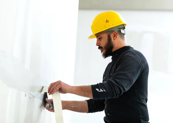 Worker plastering gypsum board wall. Stock Photo by ©AntonioGravante ...
