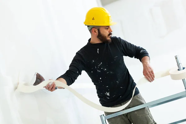 Worker plastering gypsum board wall. — Stock Photo © AntonioGravante ...