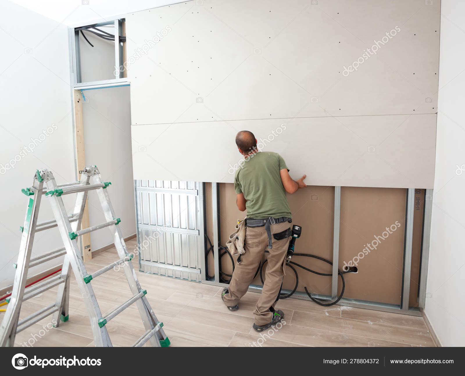 Worker building plasterboard wall. — Stock Photo © AntonioGravante ...