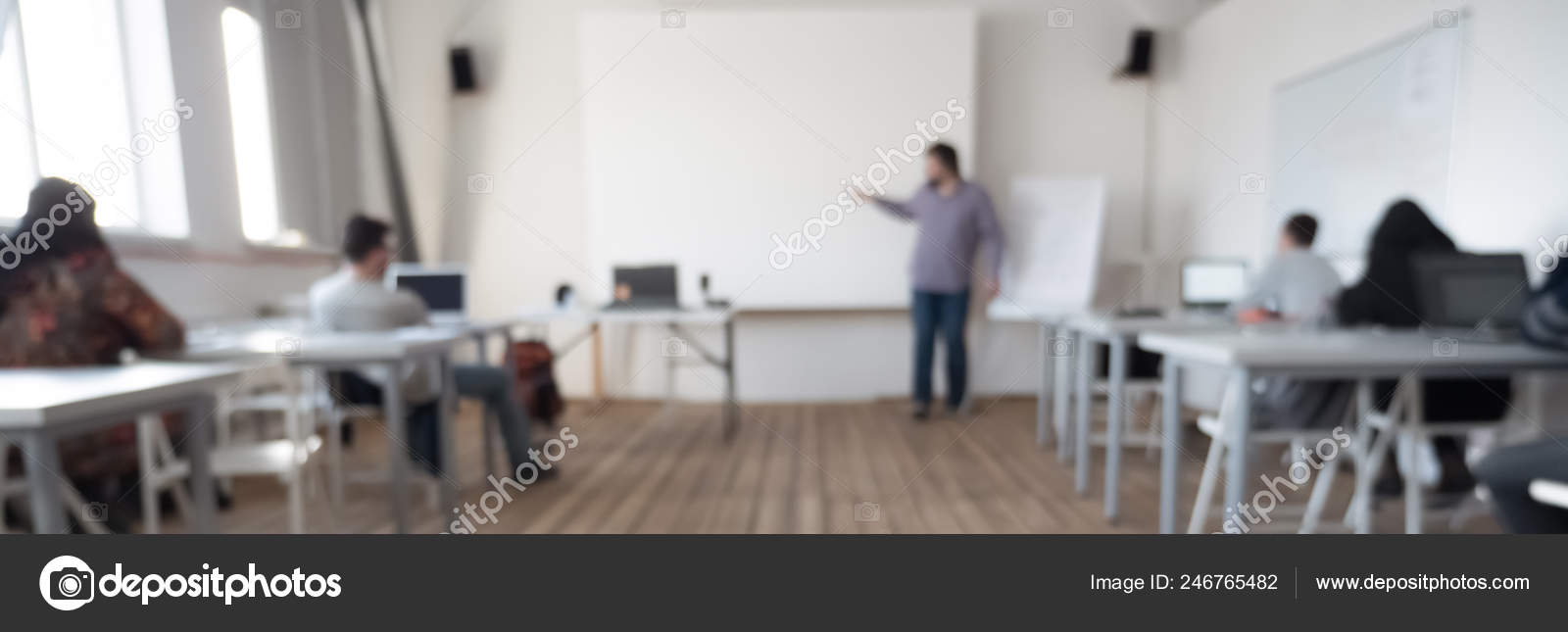 Lecturing process. Teacher with students in classroom. Project ...