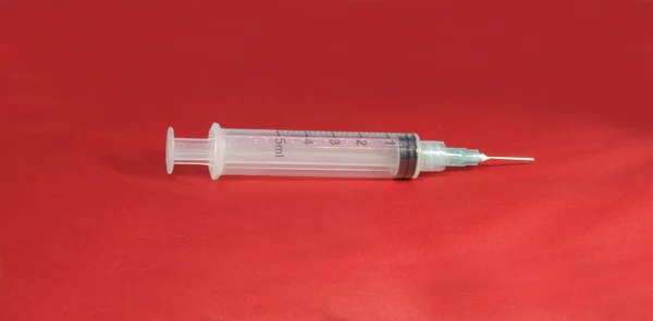 Syringe with red injection Stock Photos, Royalty Free Syringe with red ...