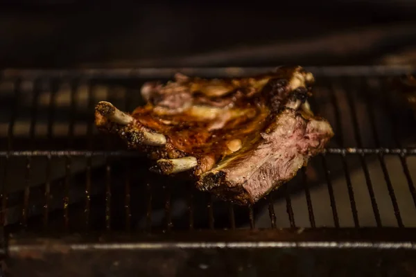 Pig ribs barbecue, Patagonia, Argentina - Stock Image - Everypixel