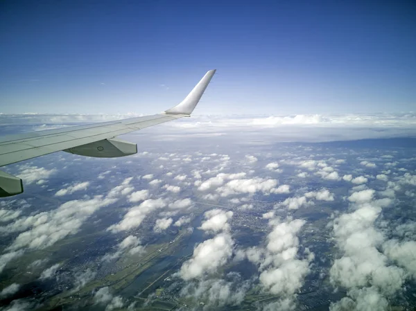 View from airplane window to see sky on Morning sunrise with Wing of an ...