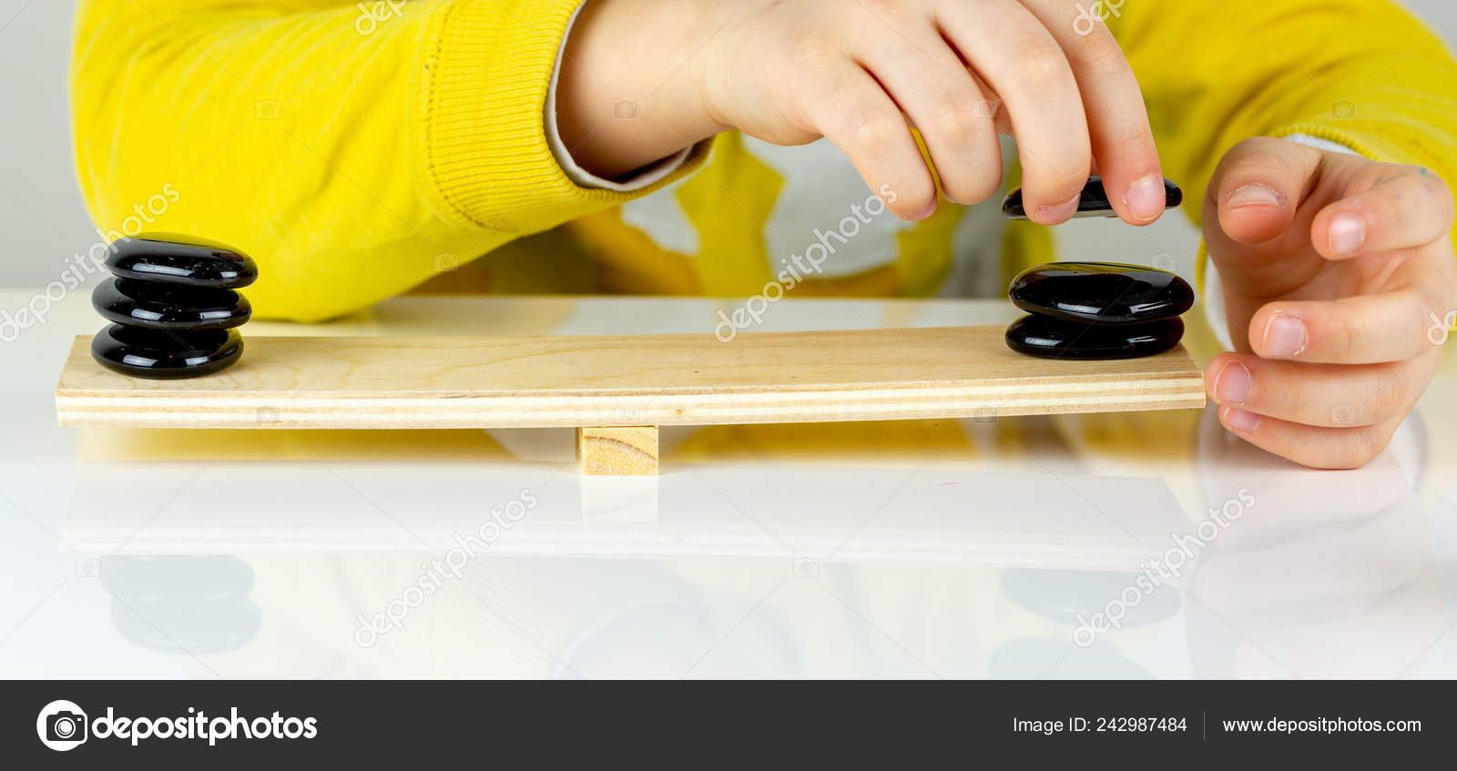 Child Posing Balancing Black Pebbles Wooden Scale — Stock Photo ...