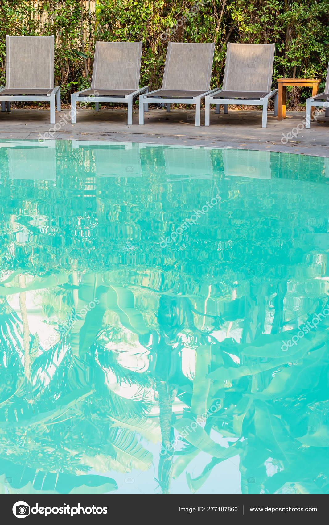Empty chair around swimming pool in hotel resort — Stock Photo ...
