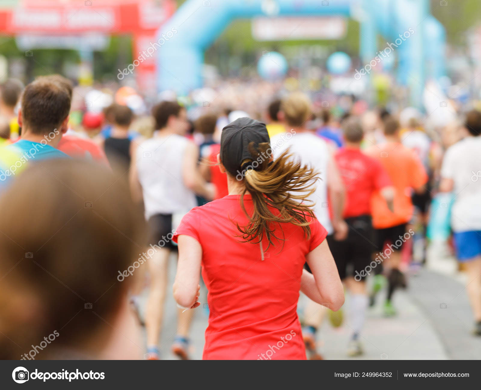 People Running A Marathon Finish Line