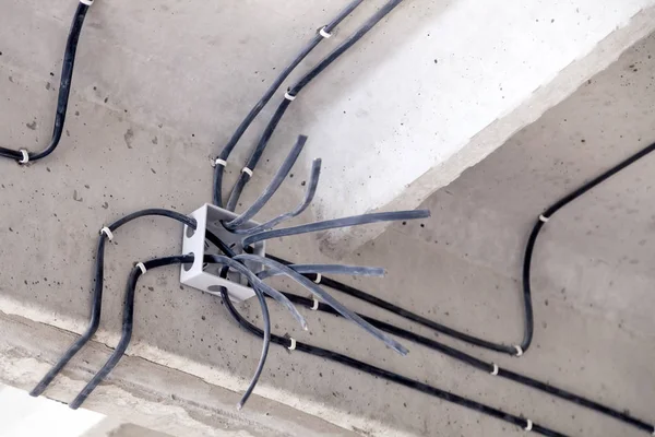 Cable laying ceiling. Electrical wires on wall. Wiring replacement ...