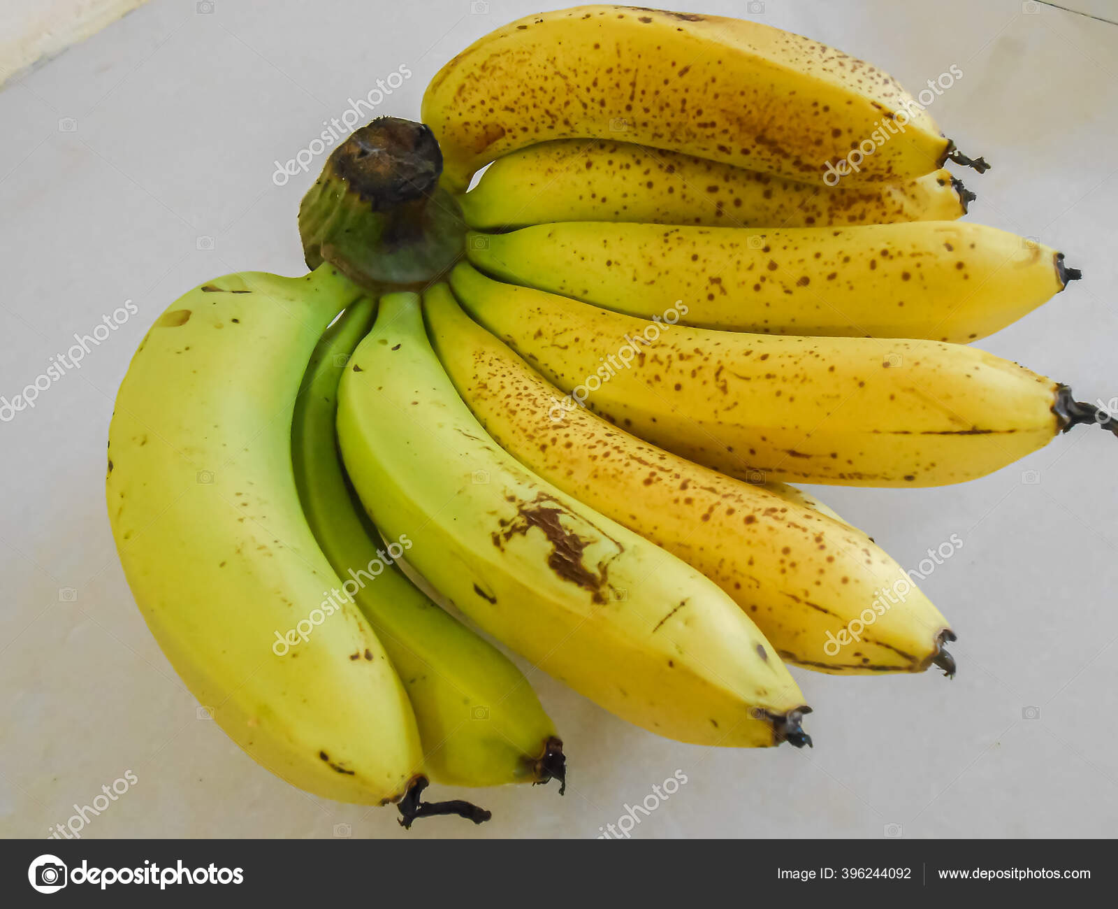 Speckled Partly Rip Lacatan Bananas Attached Stem Sitting White Surface ...