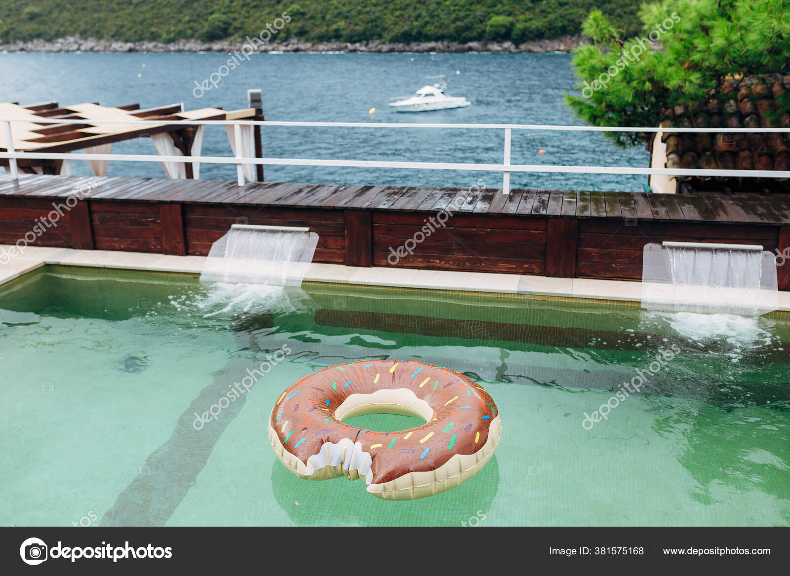A swimming inflatable circle floats in a swimming pool overlooking the ... A swimming inflatable circle floats in a swimming pool overlooking the ...
