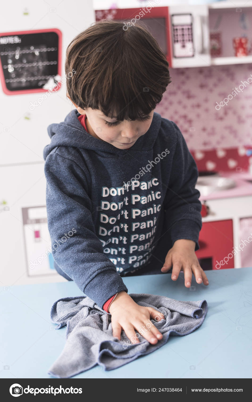 Boy Cleaning Table