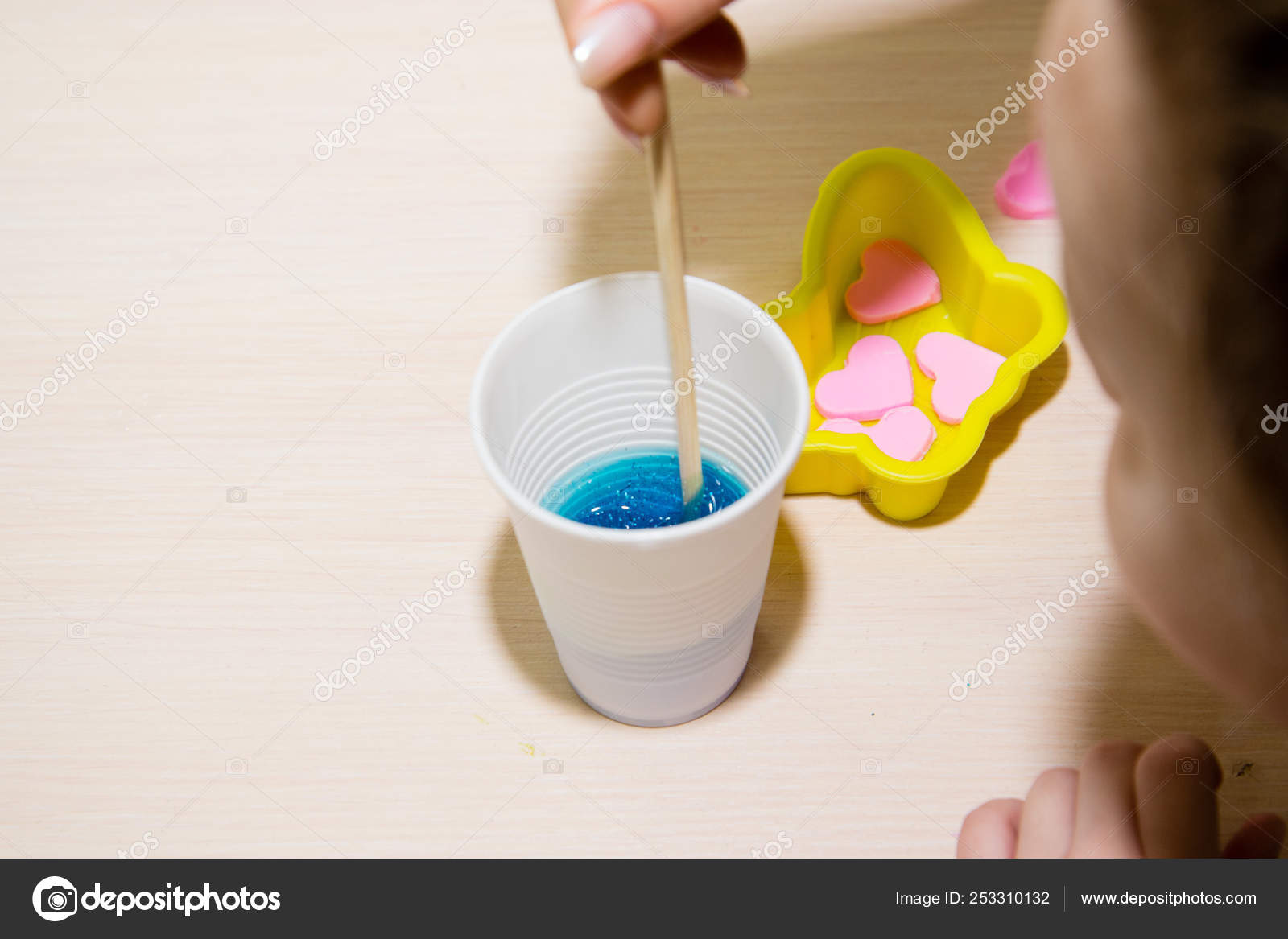 Process of homemade soap, mixing lye solution into oil. Making a gift ...