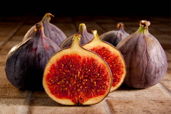 The fig is a soft pear-shaped fruit with sweet dark flesh and many ...