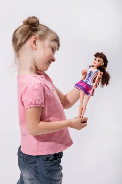 Smiling Little Girl Holding Doll Studio Stock Photo by ©smallblackcat ...