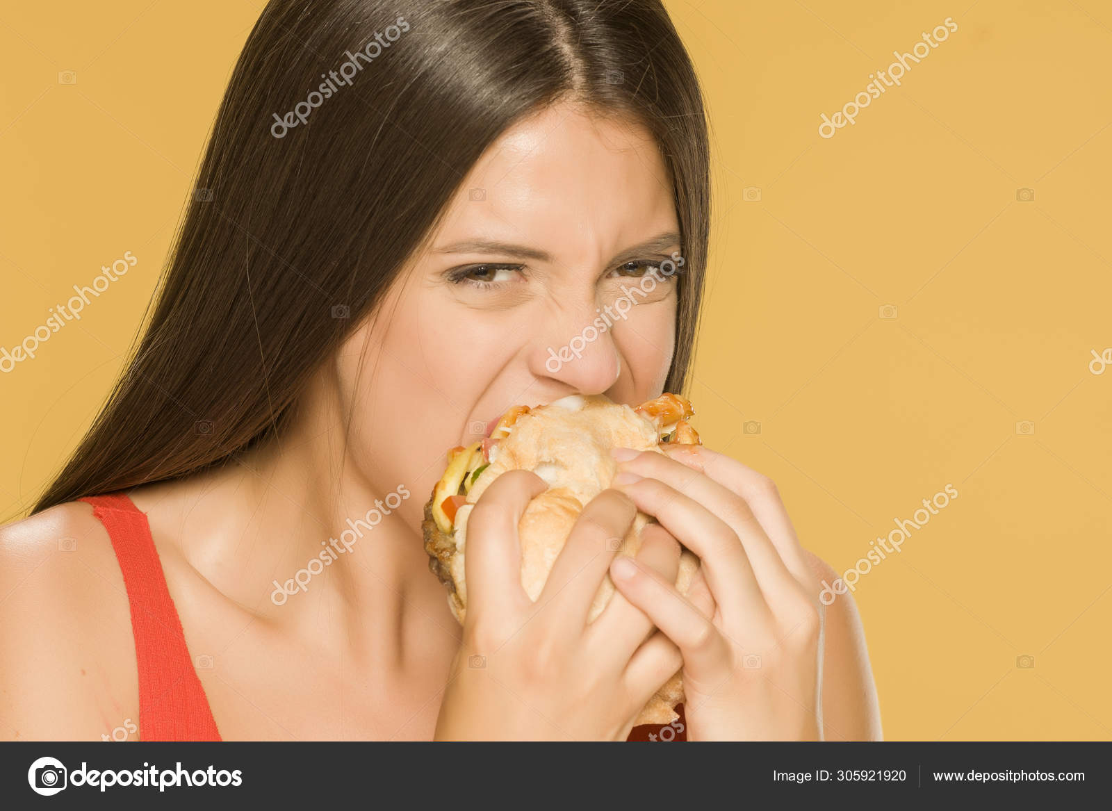 Young Greedy Woman Eating Burger Yellow Background Stock Photo by ...