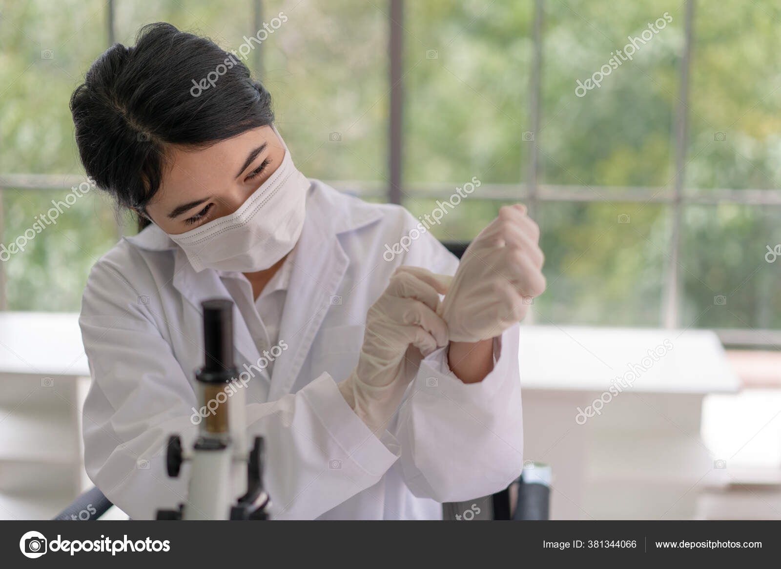 Young Scientist Wearing Rubber Gloves — Stock Photo © amornchaijj ...